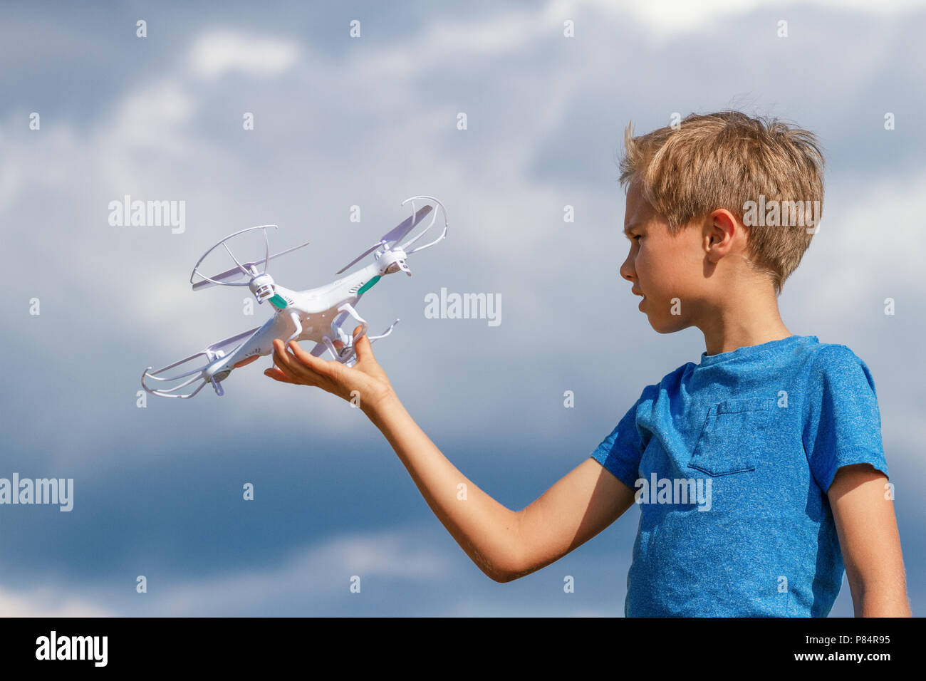 Kid flying helicopter hi-res stock photography and images - Alamy