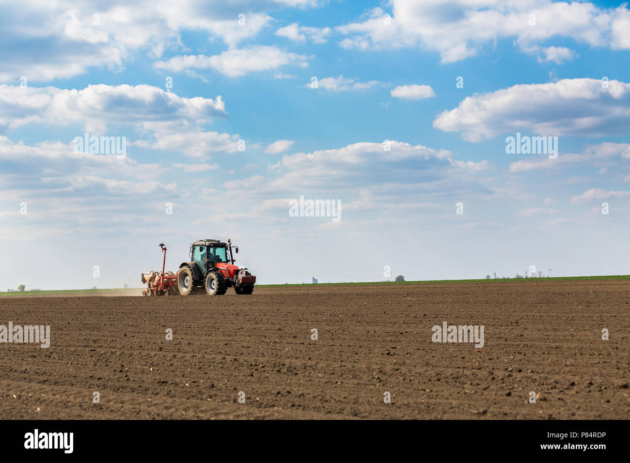 Farmer seeding, sowing crops at field. Sowing is the process of ...