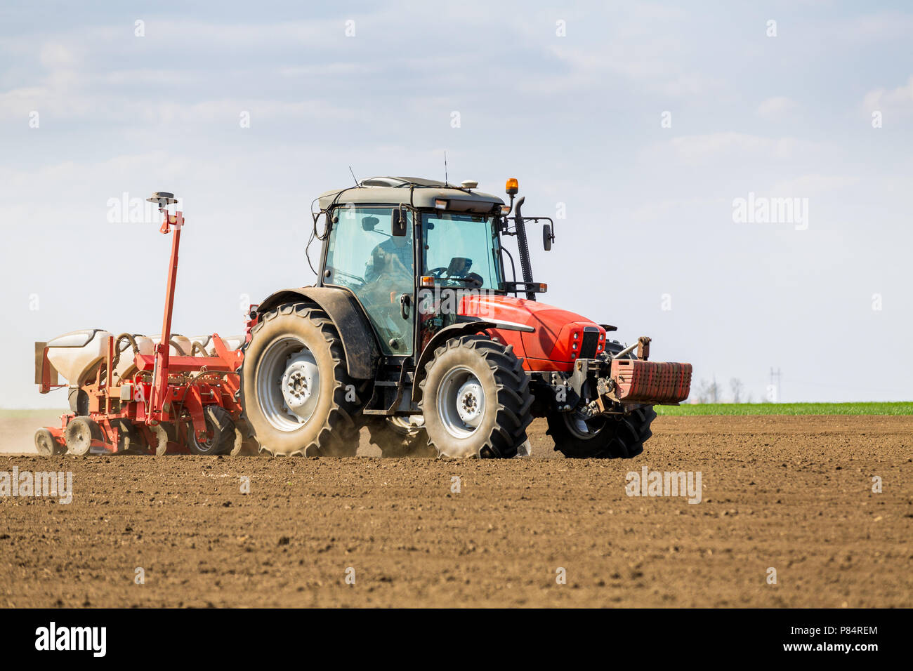 Farmer seeding, sowing crops at field. Sowing is the process of ...