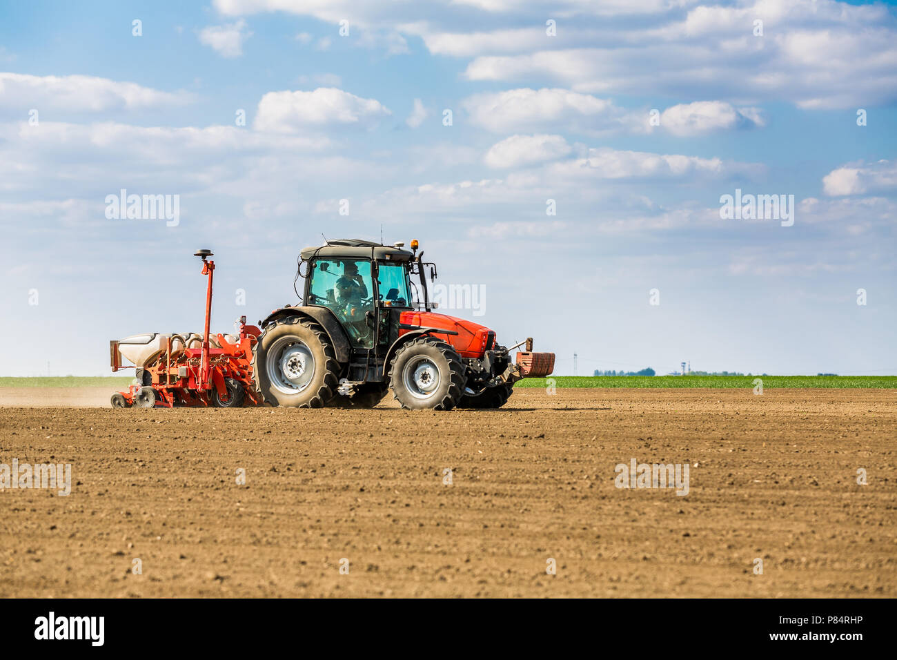 Farmer seeding, sowing crops at field. Sowing is the process of ...