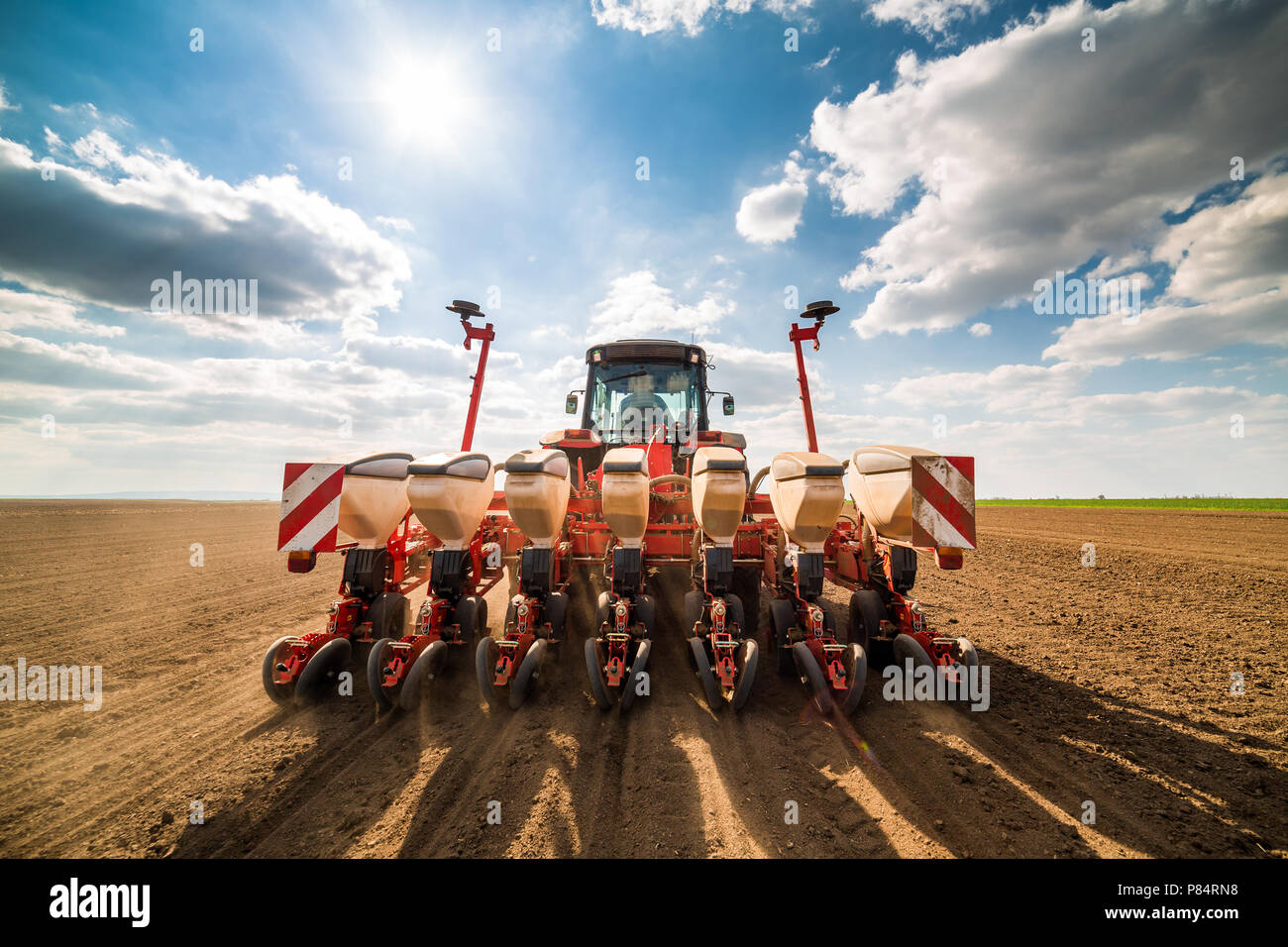Farmer seeding, sowing crops at field. Sowing is the process of ...