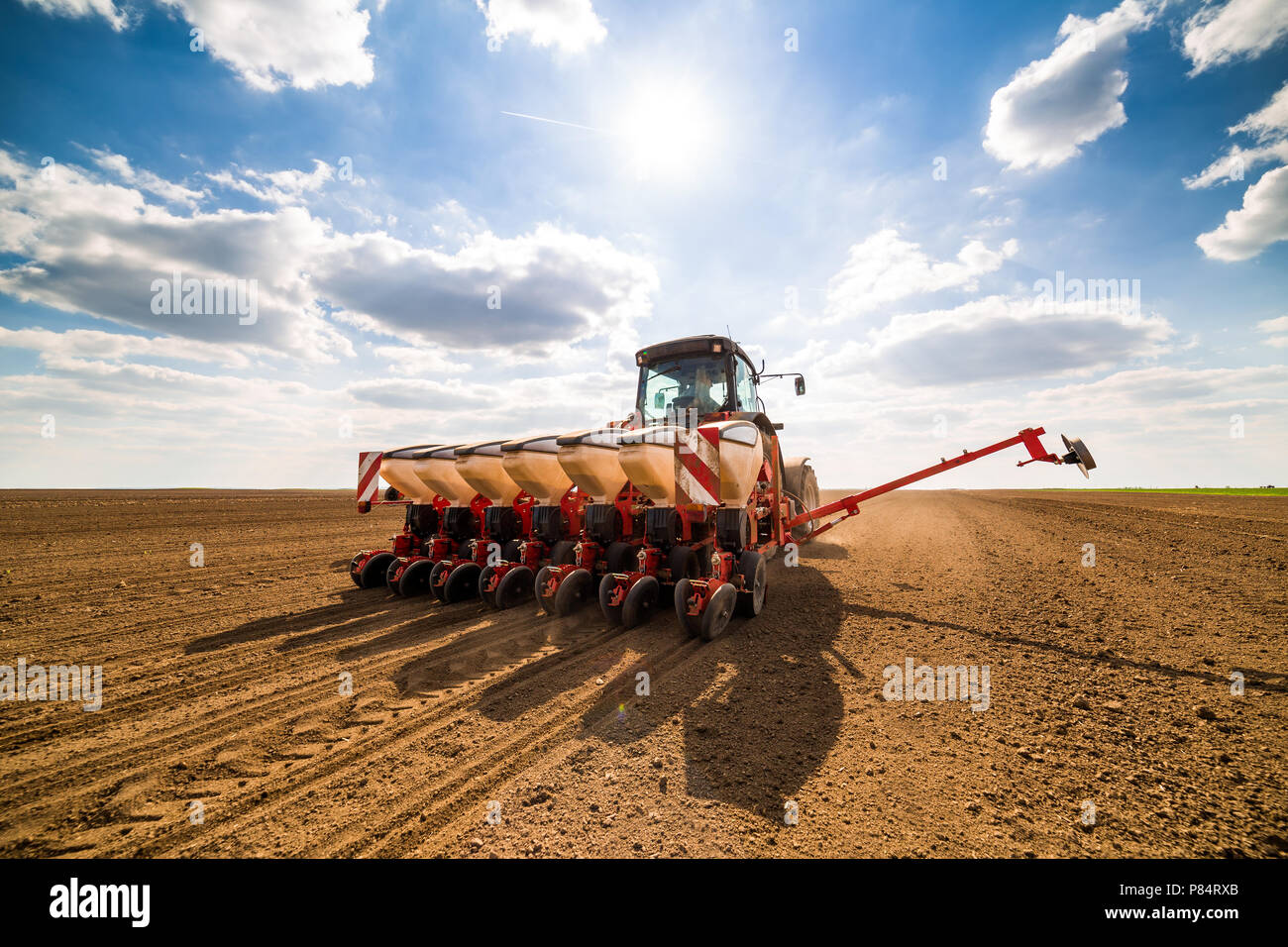 Farmer seeding, sowing crops at field. Sowing is the process of ...