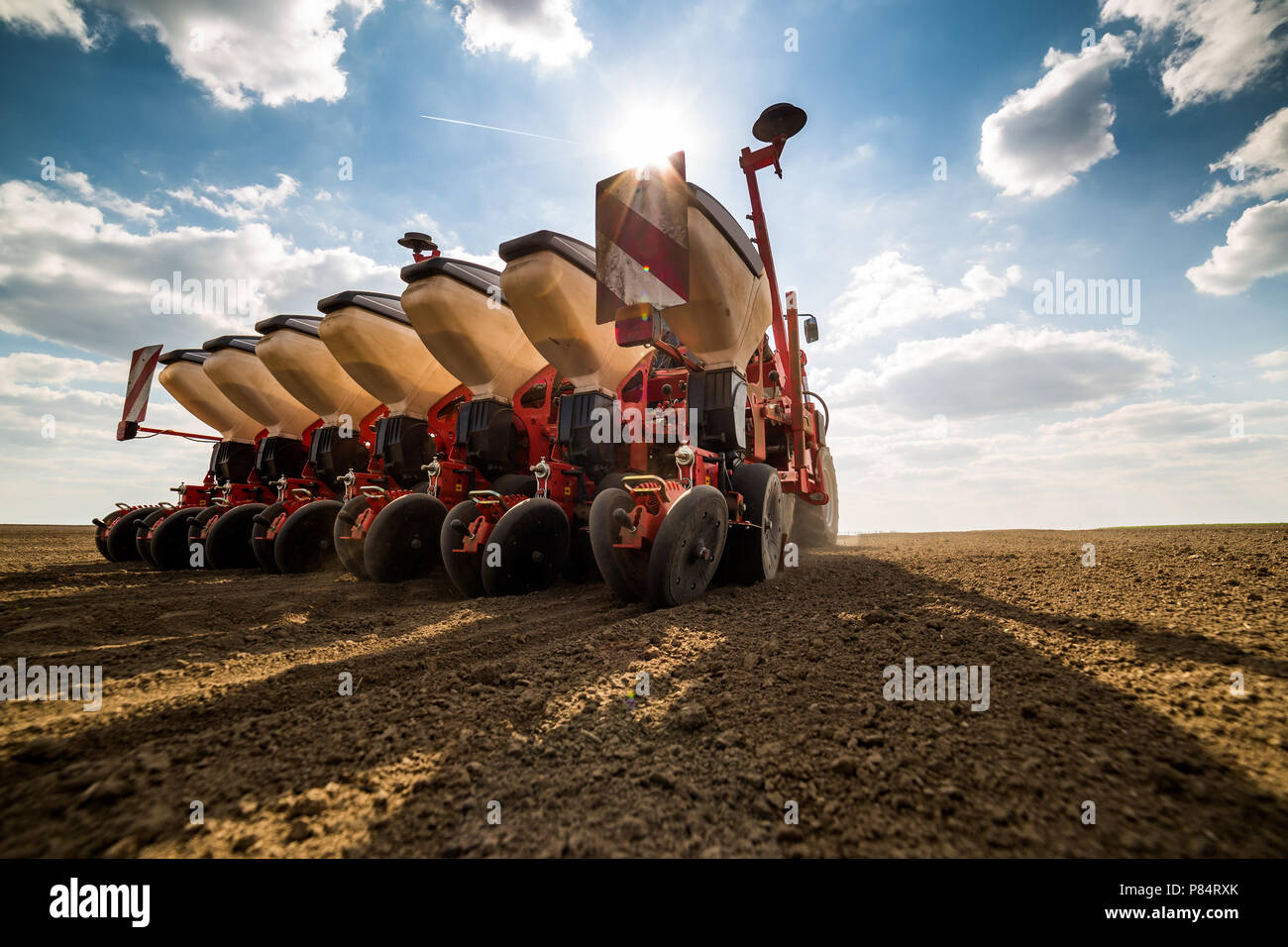 Farmer seeding, sowing crops at field. Sowing is the process of ...