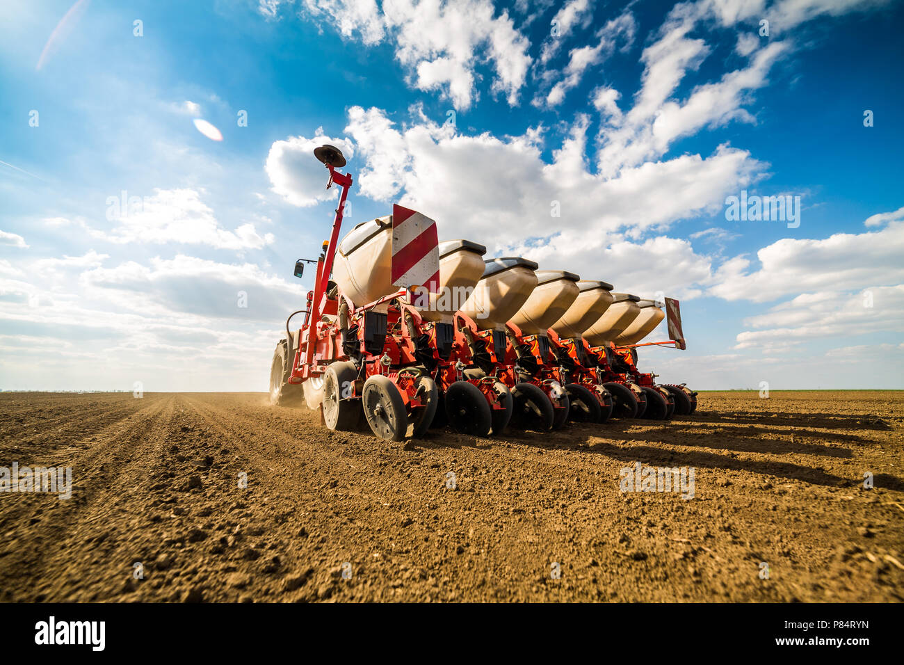 Farmer seeding, sowing crops at field. Sowing is the process of ...