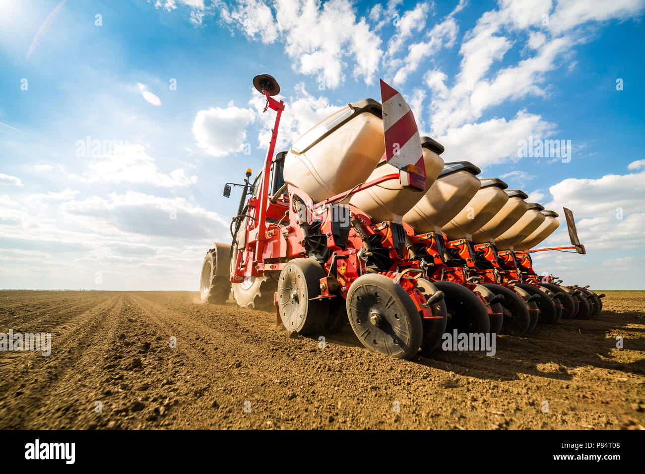 Farmer seeding, sowing crops at field. Sowing is the process of ...