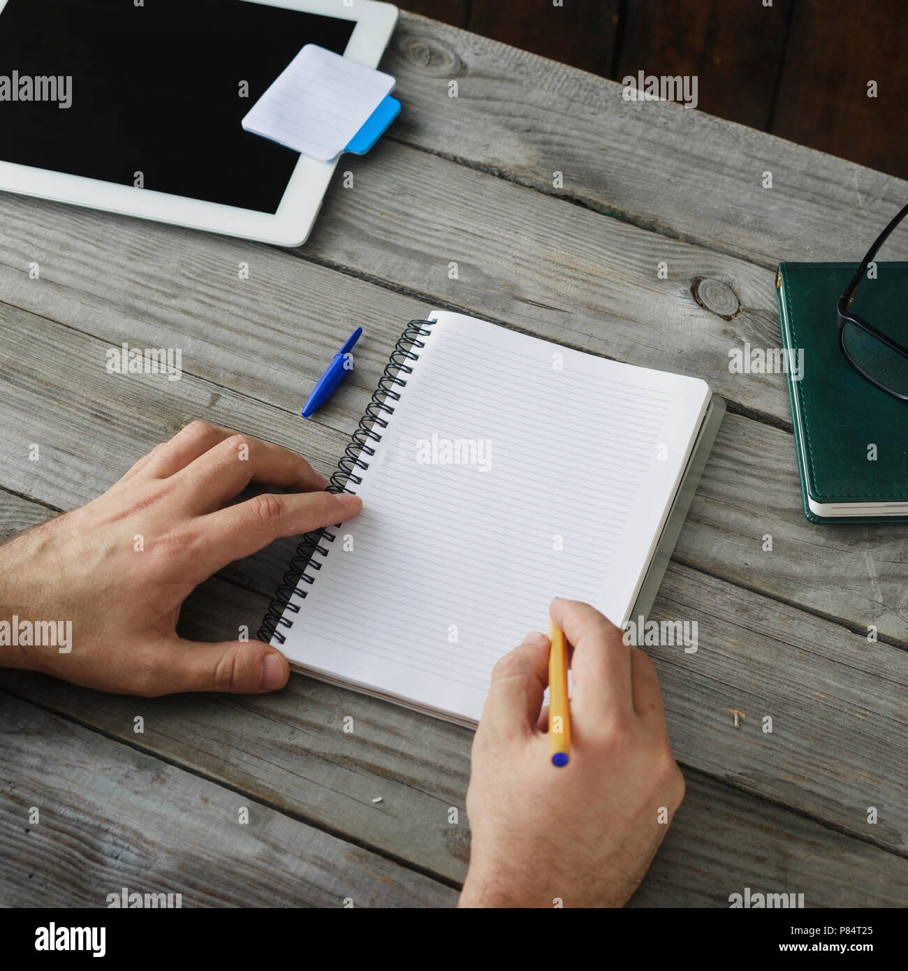 Top view young man writes hi-res stock photography and images - Alamy