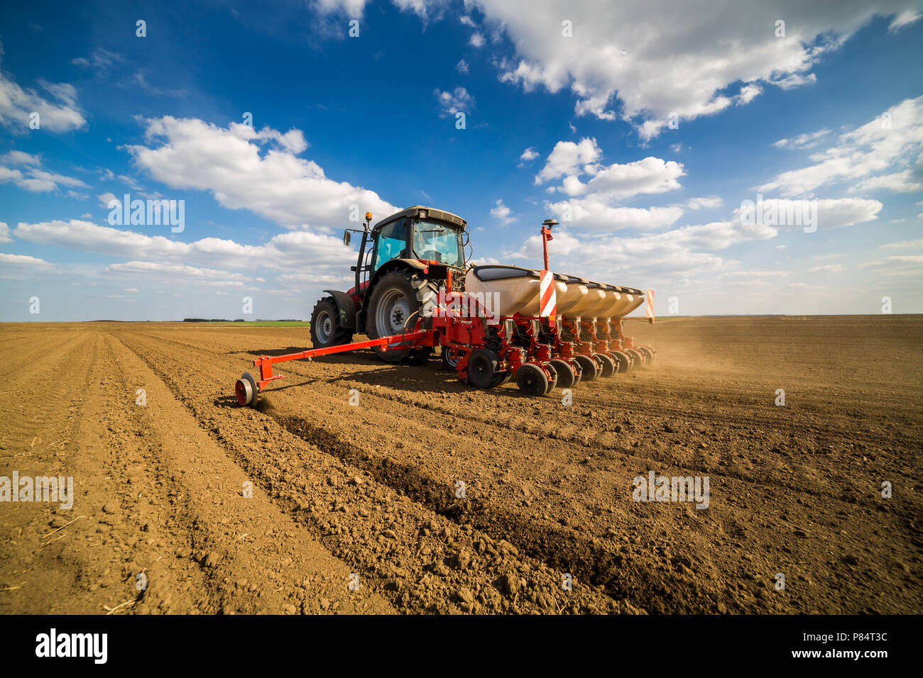 Farmer seeding, sowing crops at field. Sowing is the process of ...