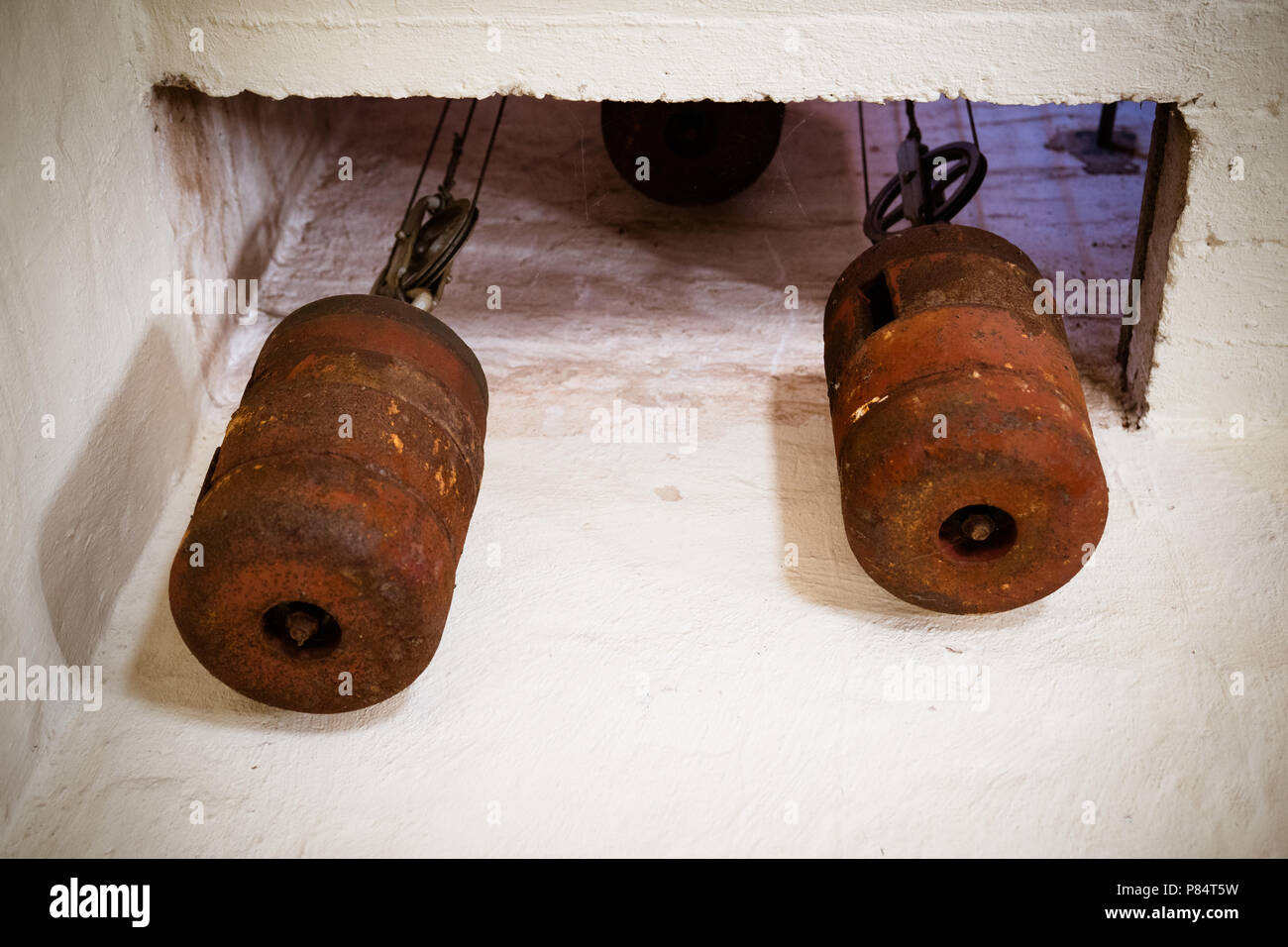 the weights in the tower clock Stock Photo - Alamy