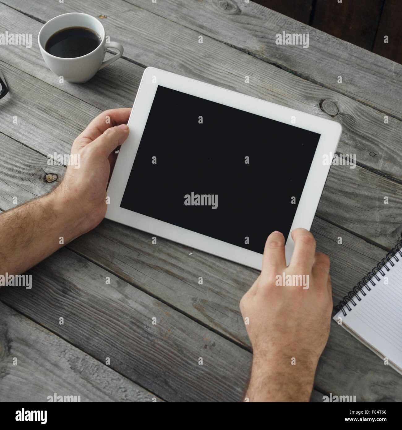 Mockup screen of tablet in hand of young hi-res stock photography and ...