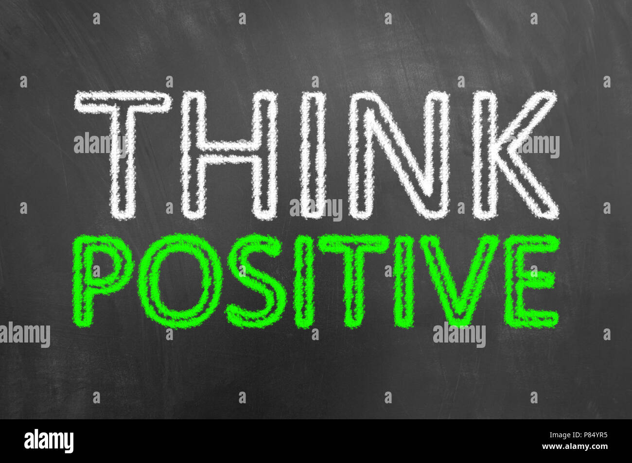 Think positive chalk text on blackboard or chalkboard as inspirational ...