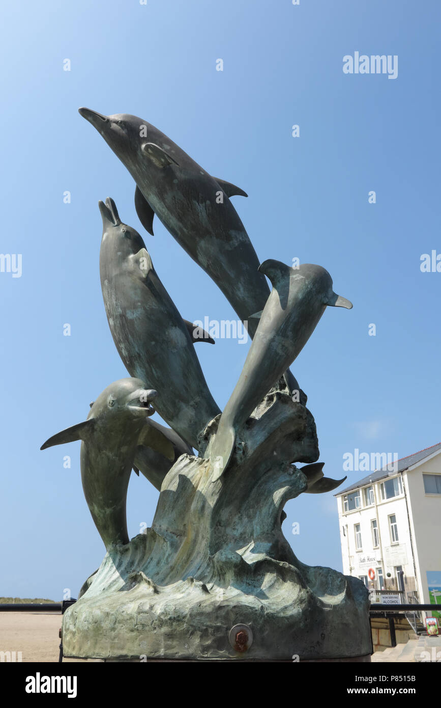 Leaping dolphins water feature, erected 2007, Barmouth harbour Stock ...