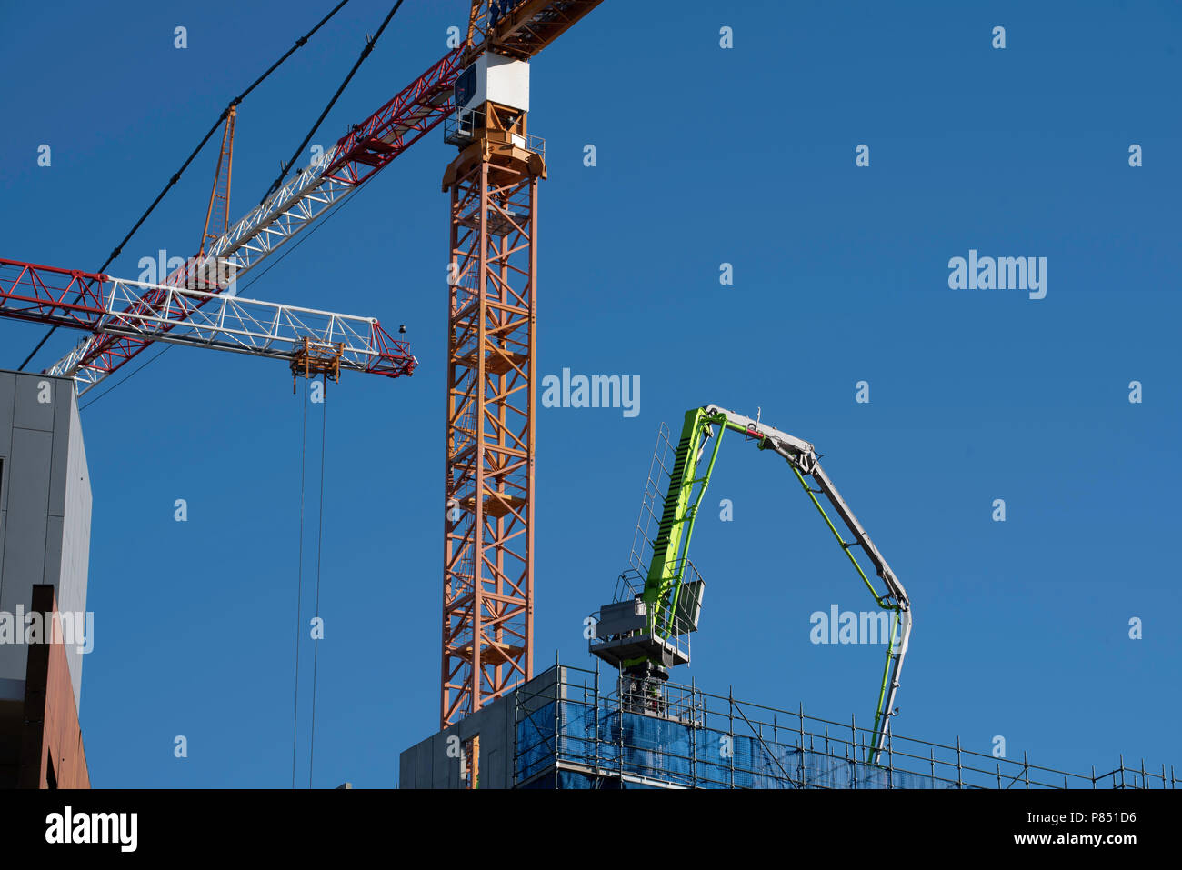 Cranes and a concrete pump on a construction site in Australia Stock ...