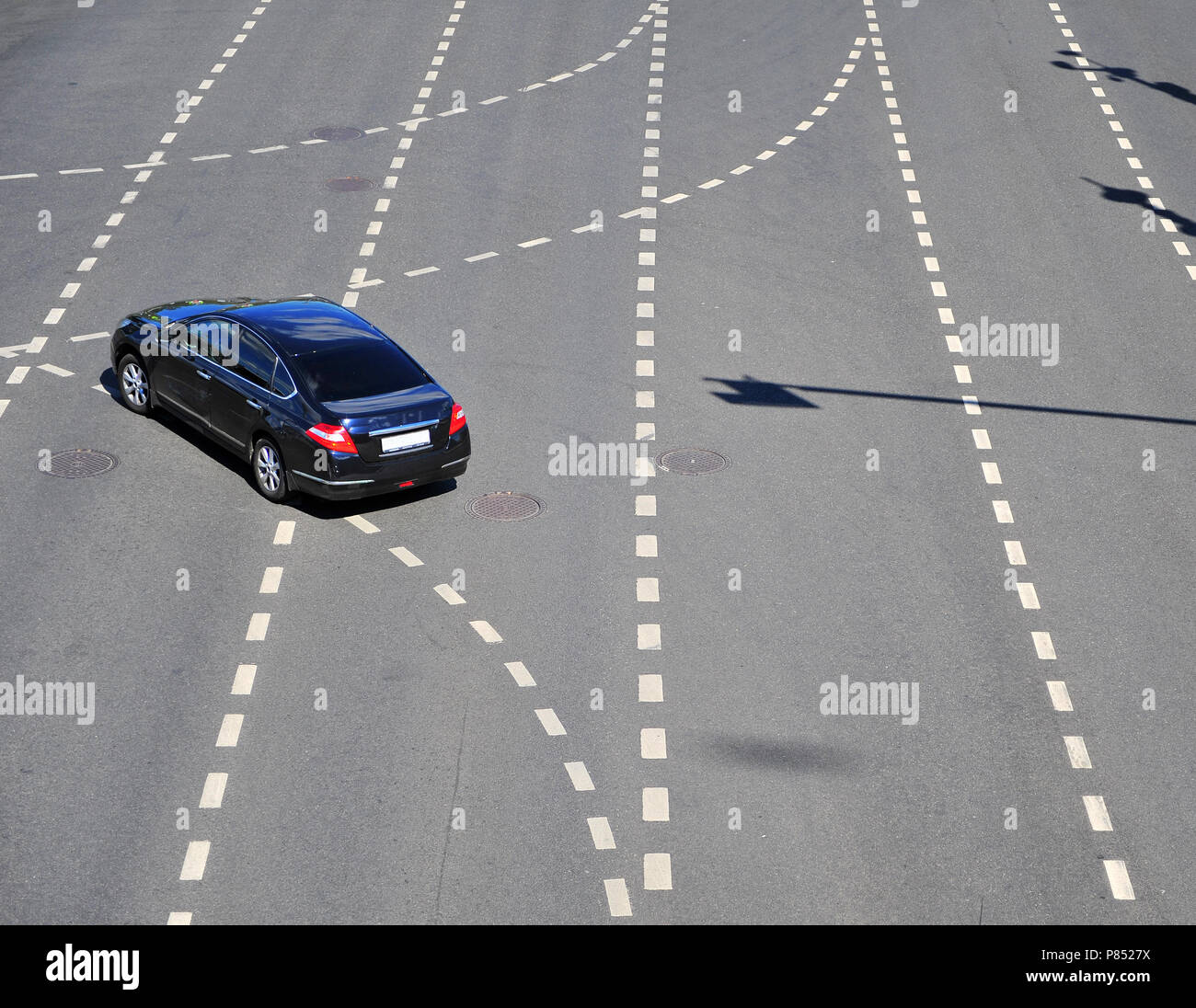 MOSCOW, RUSSIA - JULY 02: Top view of the black car turning on highway ...