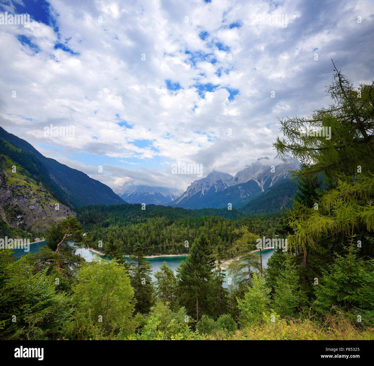 View into beautiful mountain lake in the Alps. Dramatic and picturesque ...