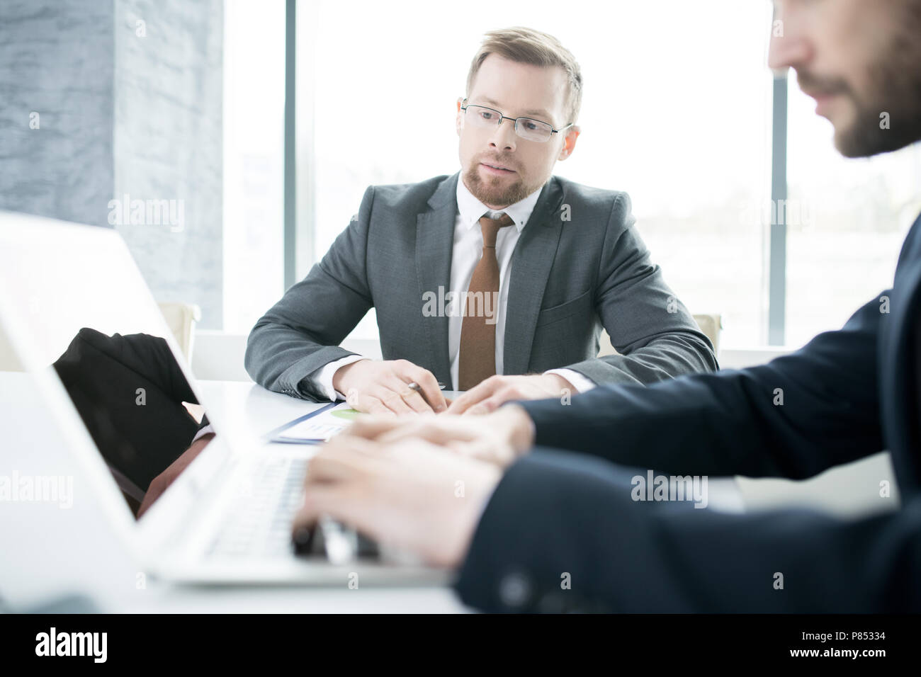 Two Business People Using Laptop Stock Photo - Alamy