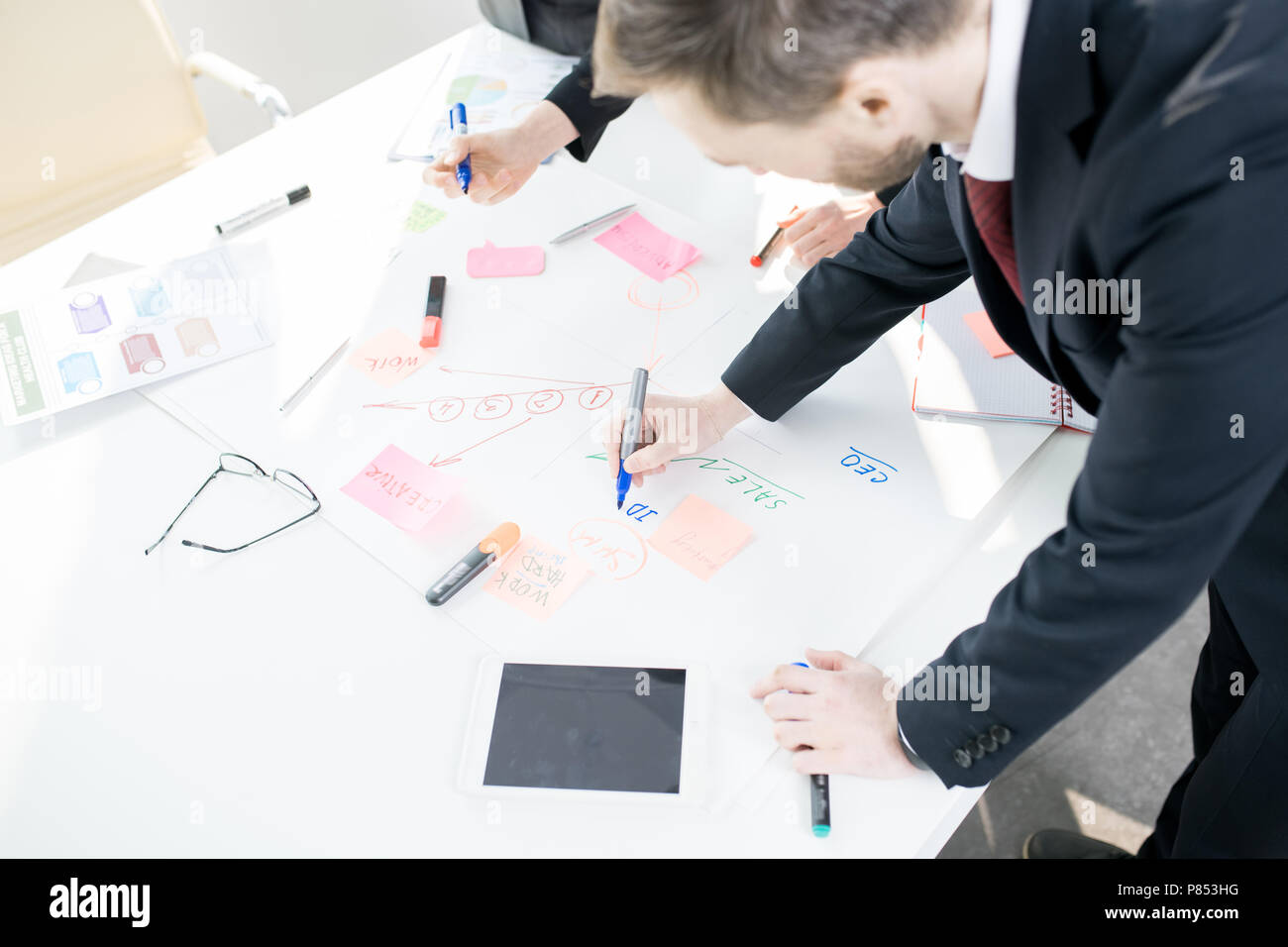 Female colleagues discussing business plan hi-res stock photography and ...