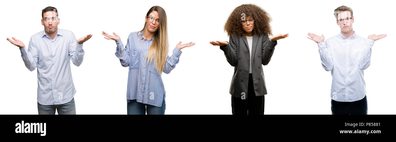 Team of business men and women clueless and confused expression with ...