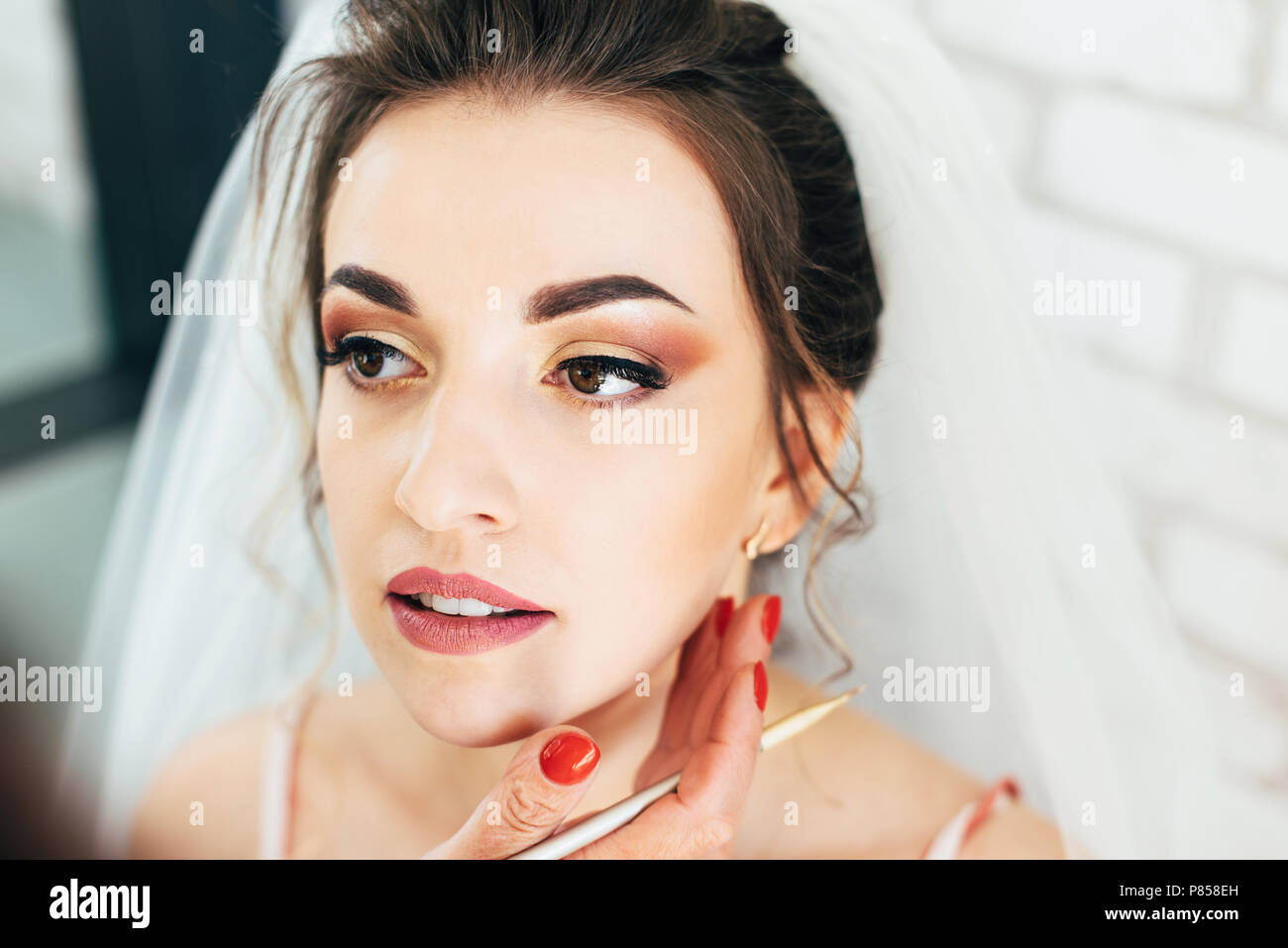 Beautiful happy bride with wedding hairstyle bright makeup in bridal ...