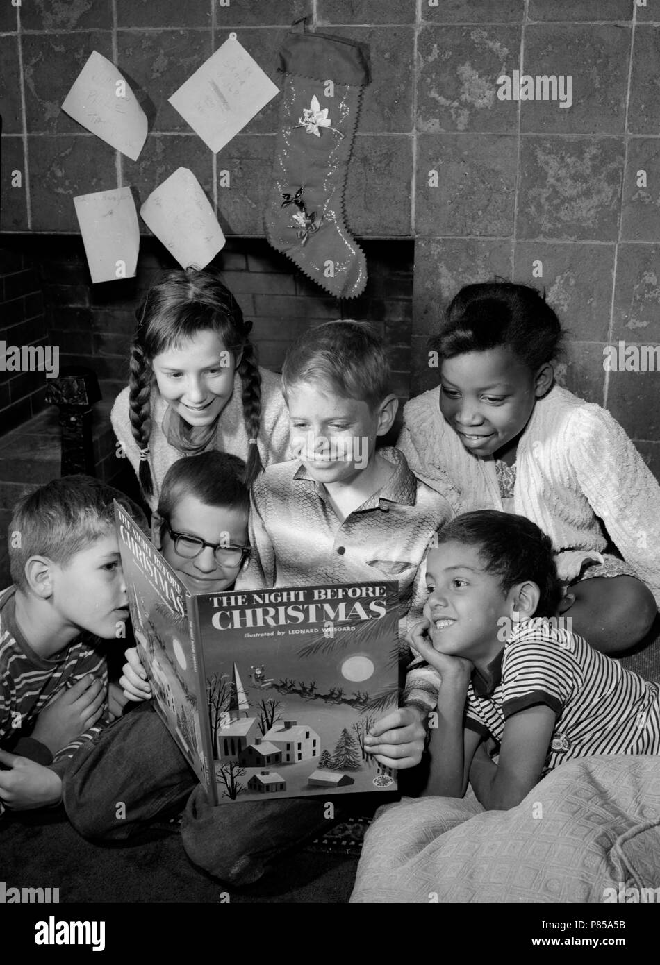 Children read the Christmas classic “The NIght Before Christmas, ca ...