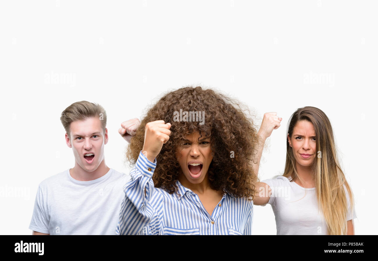 Group of young people over white background annoyed and frustrated ...