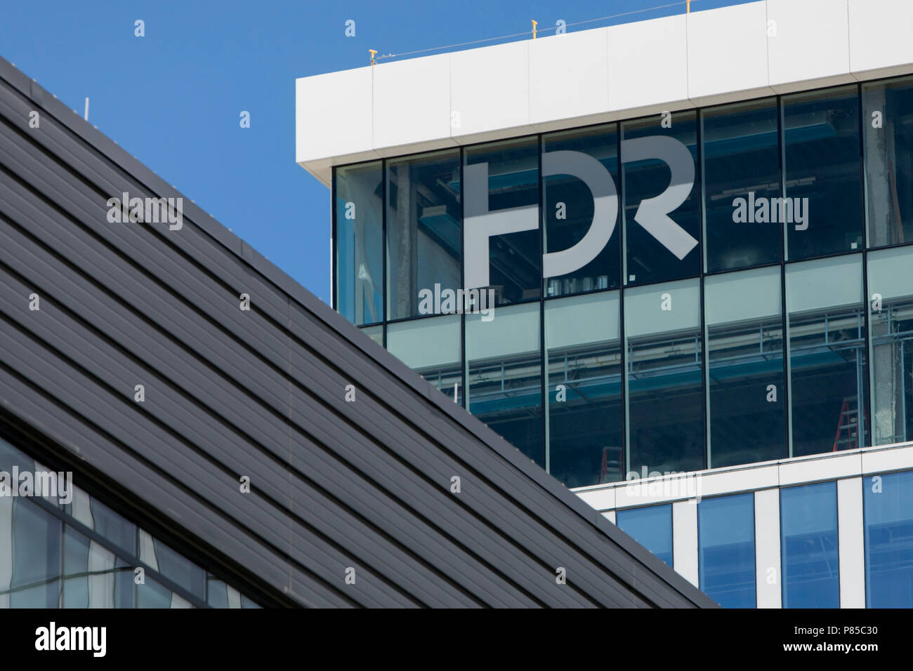 A logo sign outside of the future headquarters of HDR, Inc., in Omaha ...