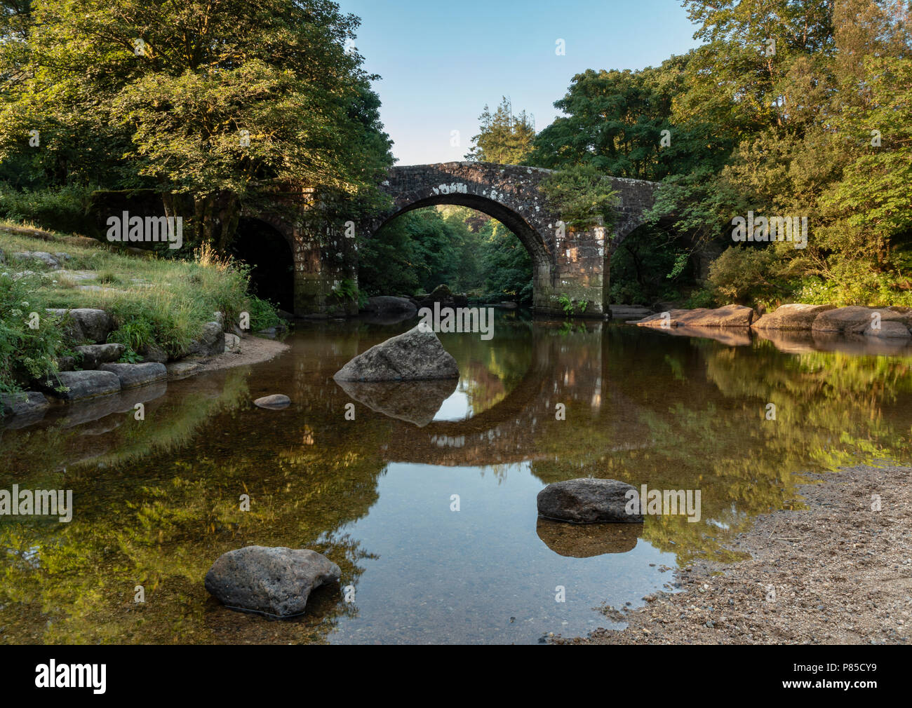 Hexworthy Dartmoor Devon England July 06, 2018 Old stone Bridge over ...