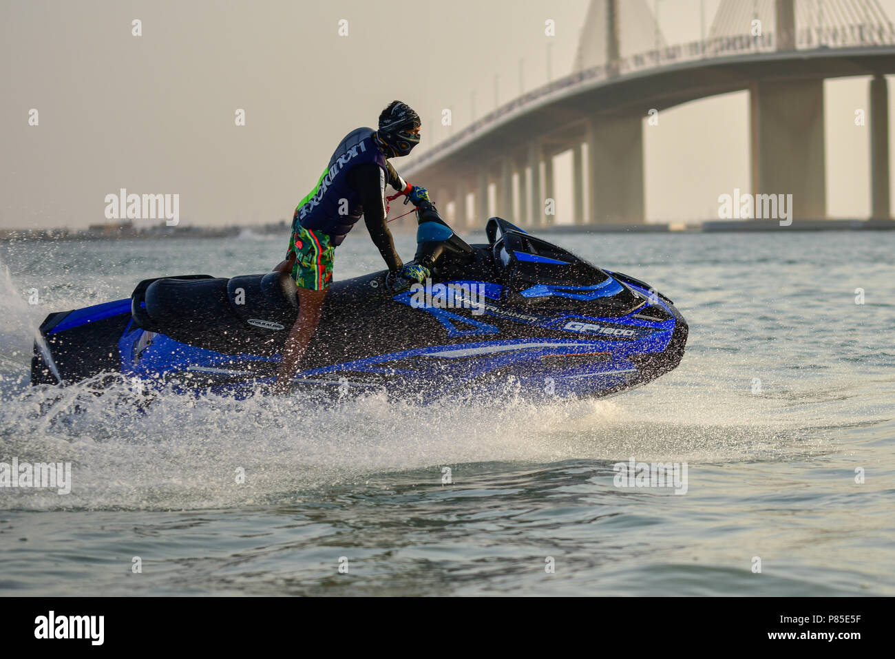 Jet skiing on Al Bateen Beach at Sunset Stock Photo - Alamy