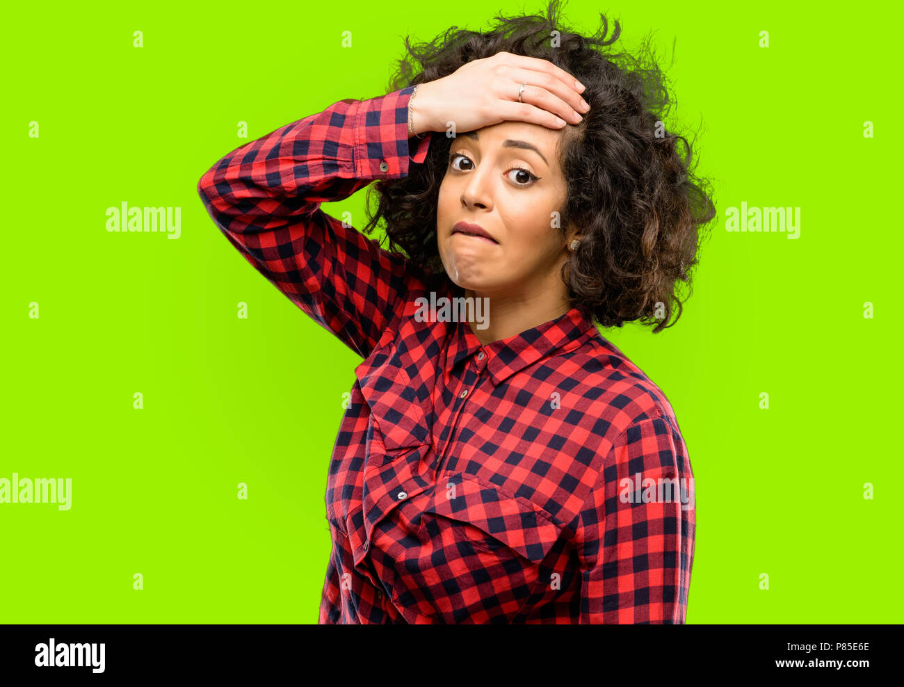 Beautiful arab woman terrified and nervous expressing anxiety and panic ...