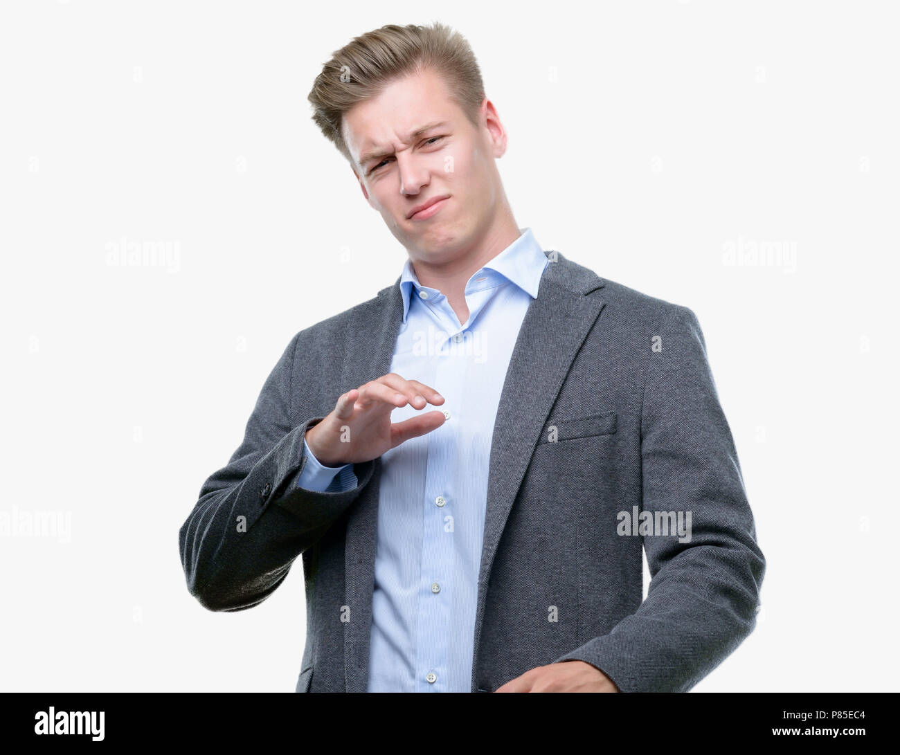 Young handsome blond business man disgusted expression, displeased and ...