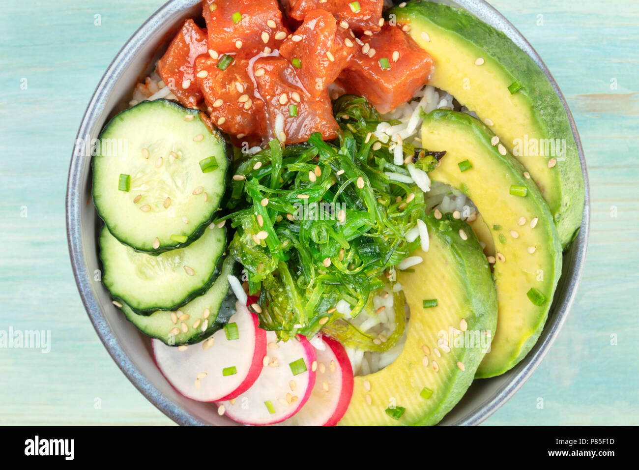 An overhead closeup photo of poke, traditional Hawaiian raw fish salad ...