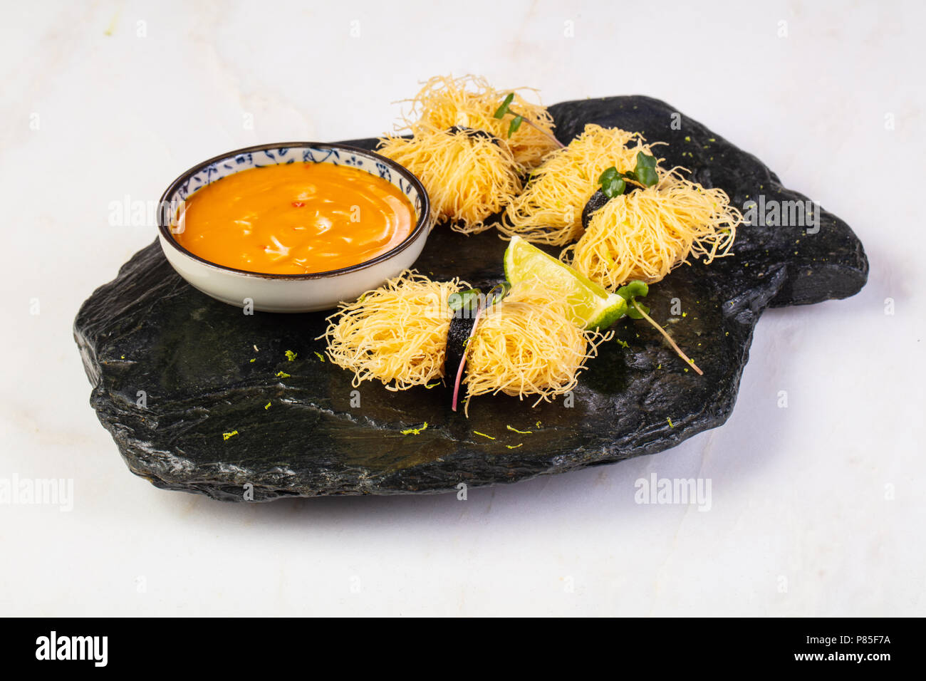 Shrimp in kataifi with mango sauce Stock Photo - Alamy