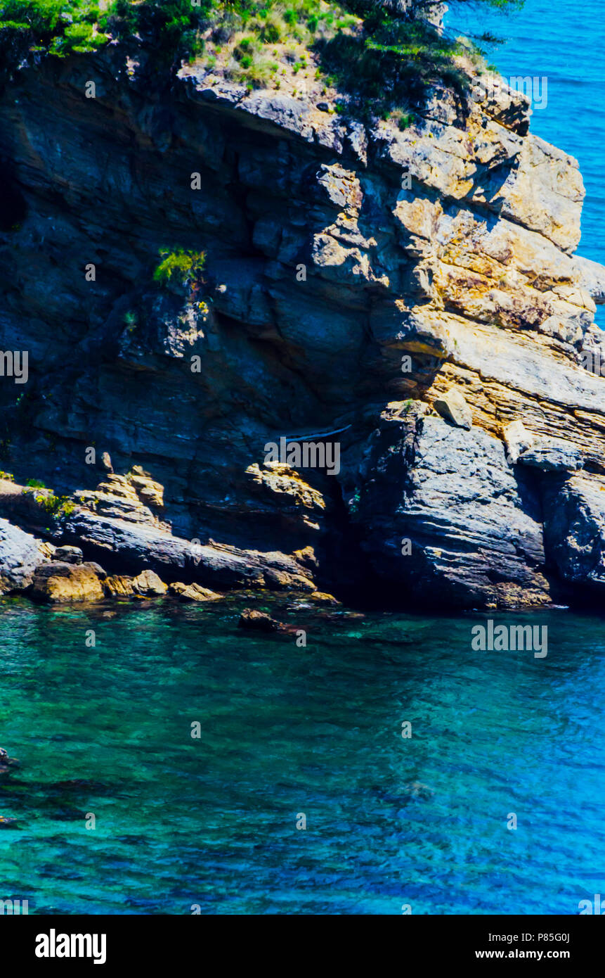 high cliff above the sea, summer sea background, many splashing waves ...