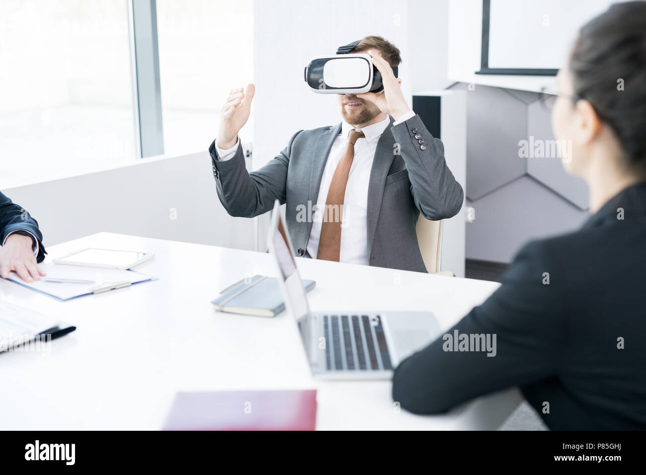 Successful young man using virtual hi-res stock photography and images ...