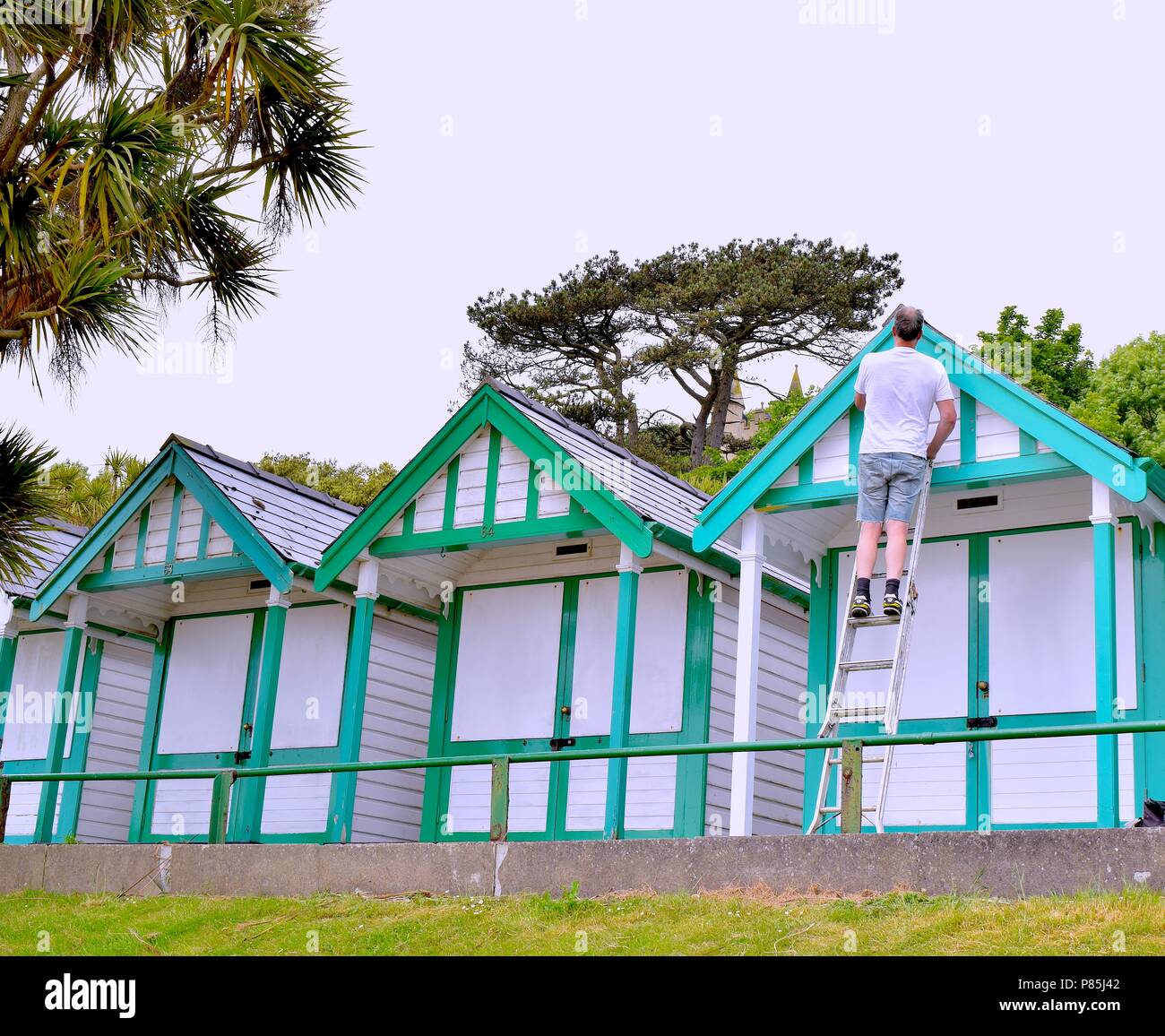 Man restoring his beach hut hi-res stock photography and images - Alamy