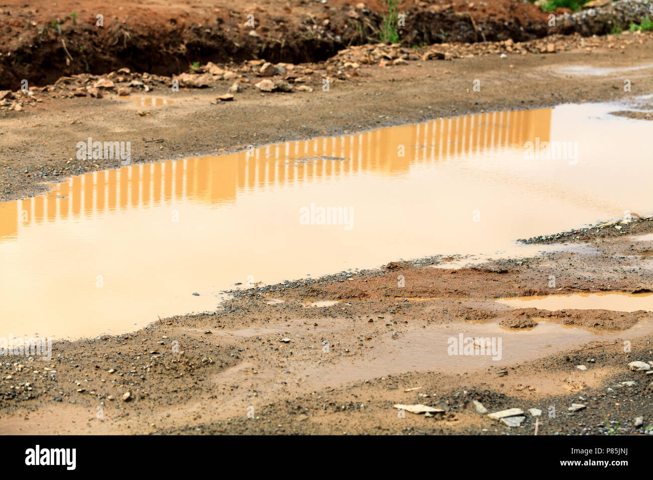 Deep puddle on a dirty road hi-res stock photography and images - Alamy