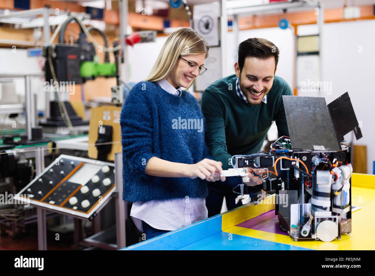 Young students of robotics working on project Stock Photo - Alamy