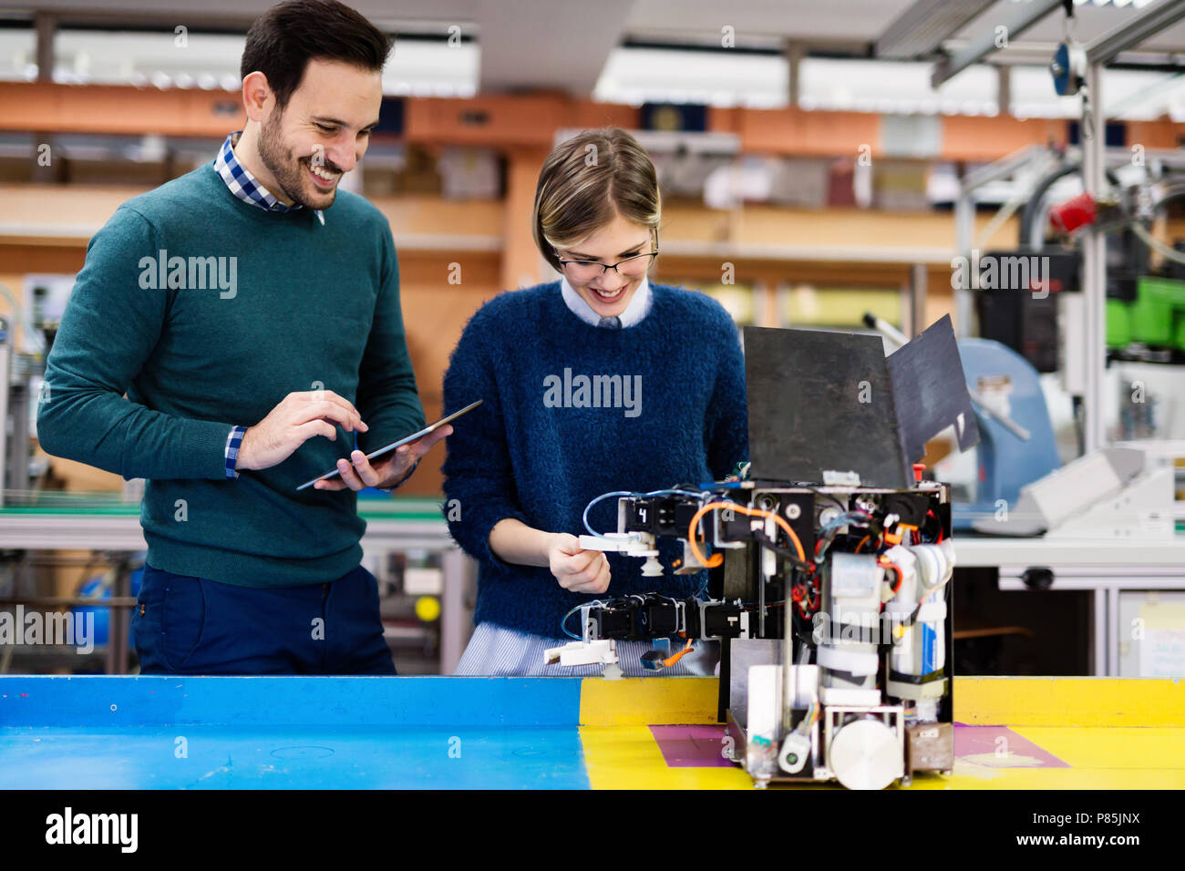 Young students of robotics working on project Stock Photo - Alamy
