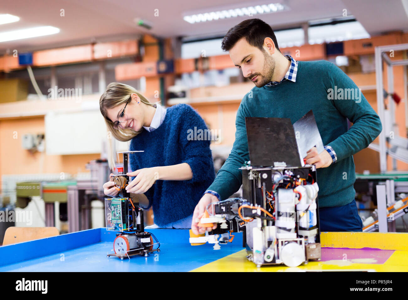 Young students of robotics working on project Stock Photo - Alamy