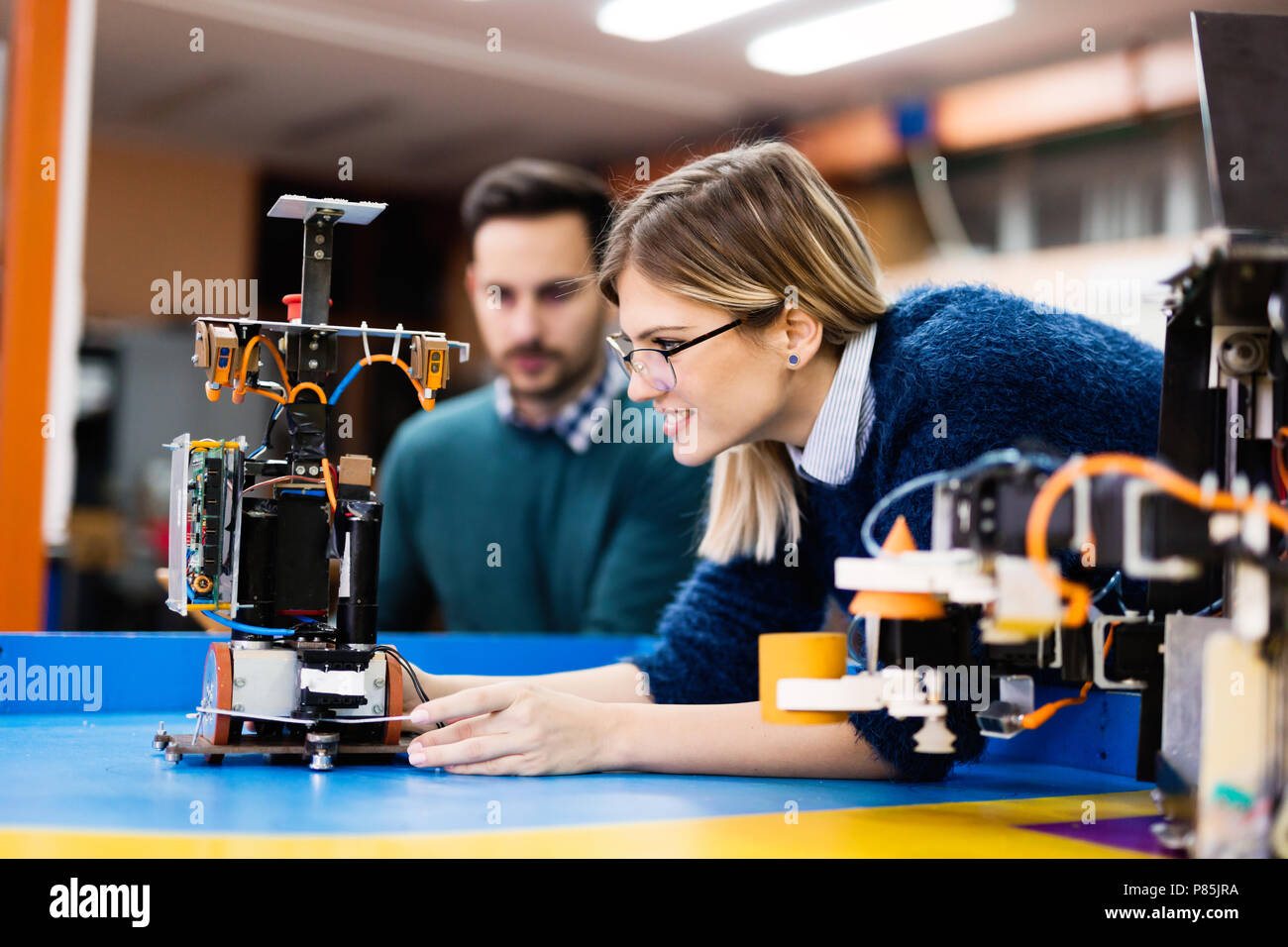 Young students of robotics working on project Stock Photo - Alamy