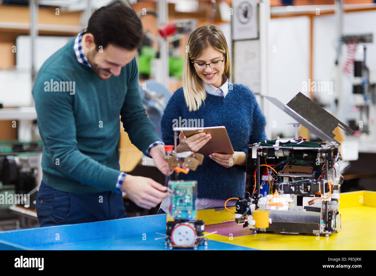 Young students of robotics working on project Stock Photo - Alamy