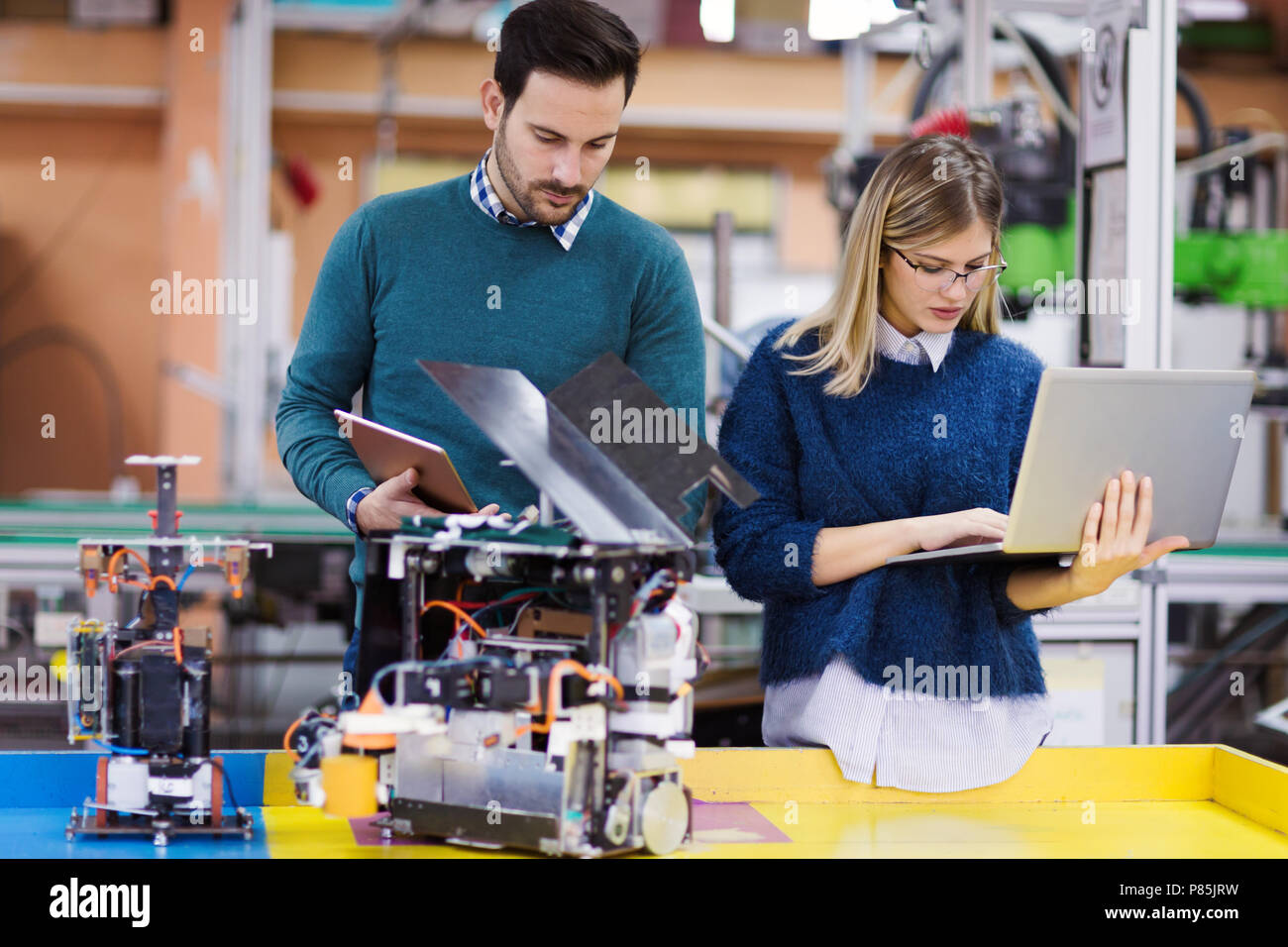 Young students of robotics working on project Stock Photo - Alamy