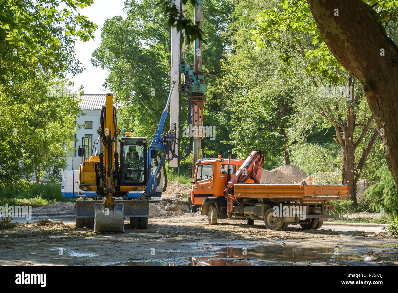 Construction machine in the mud after the rain Stock Photo - Alamy