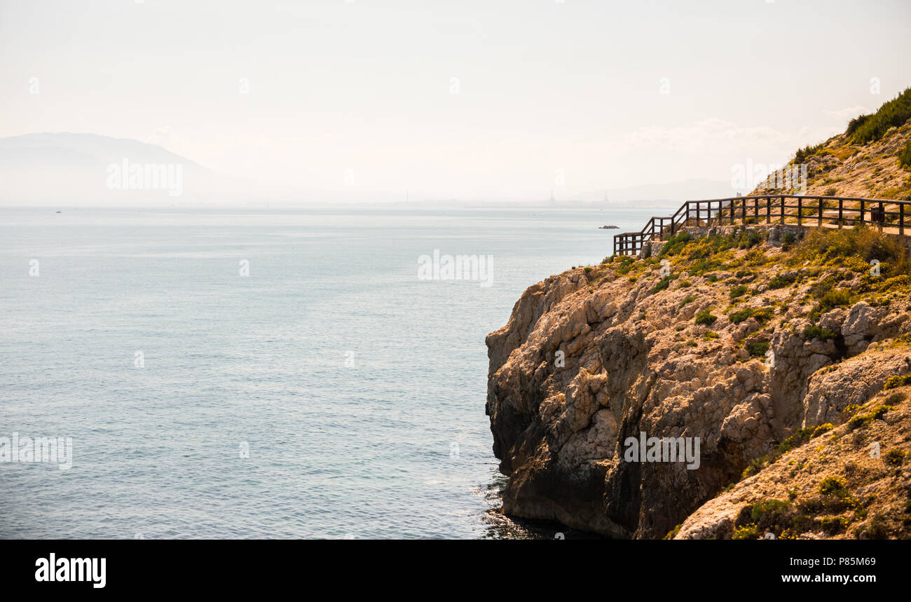 high cliff above the sea, summer sea background, many splashing waves ...