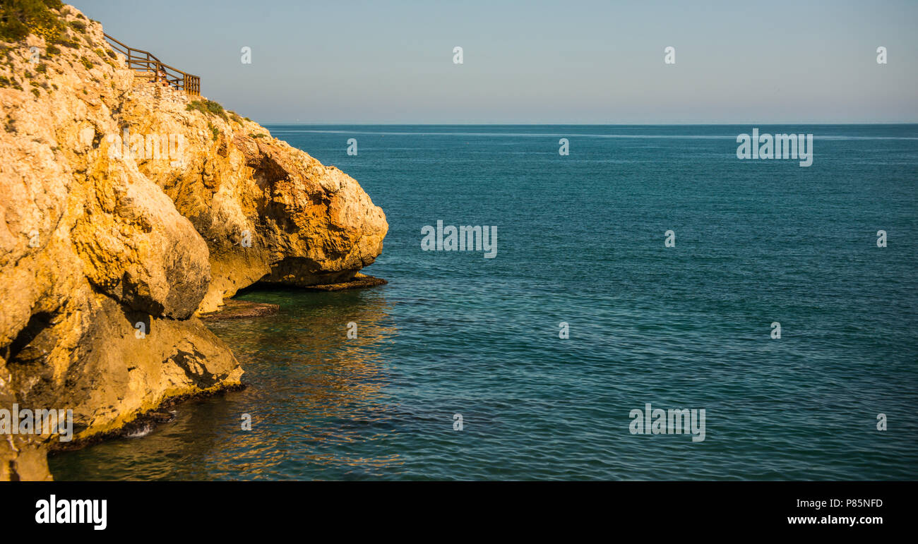 high cliff above the sea, summer sea background, many splashing waves ...
