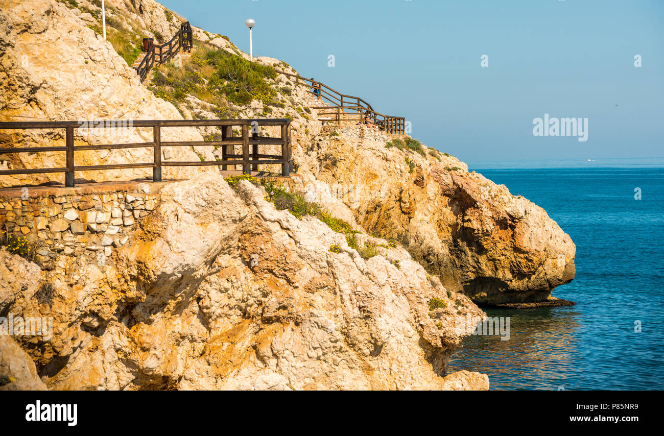 wooden promenade along the sea coast situated on a cliff rock in Rincon ...