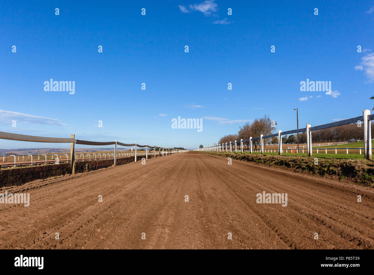 Race horse sand training track looking down long straight with white ...
