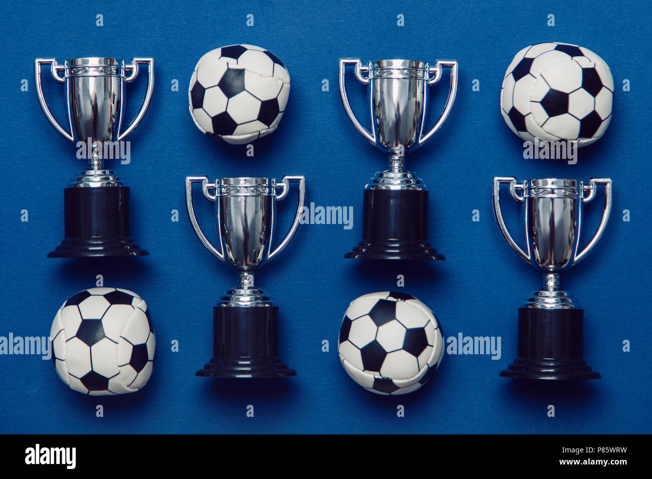 Soccer ball with a silver winning trophy Stock Photo - Alamy