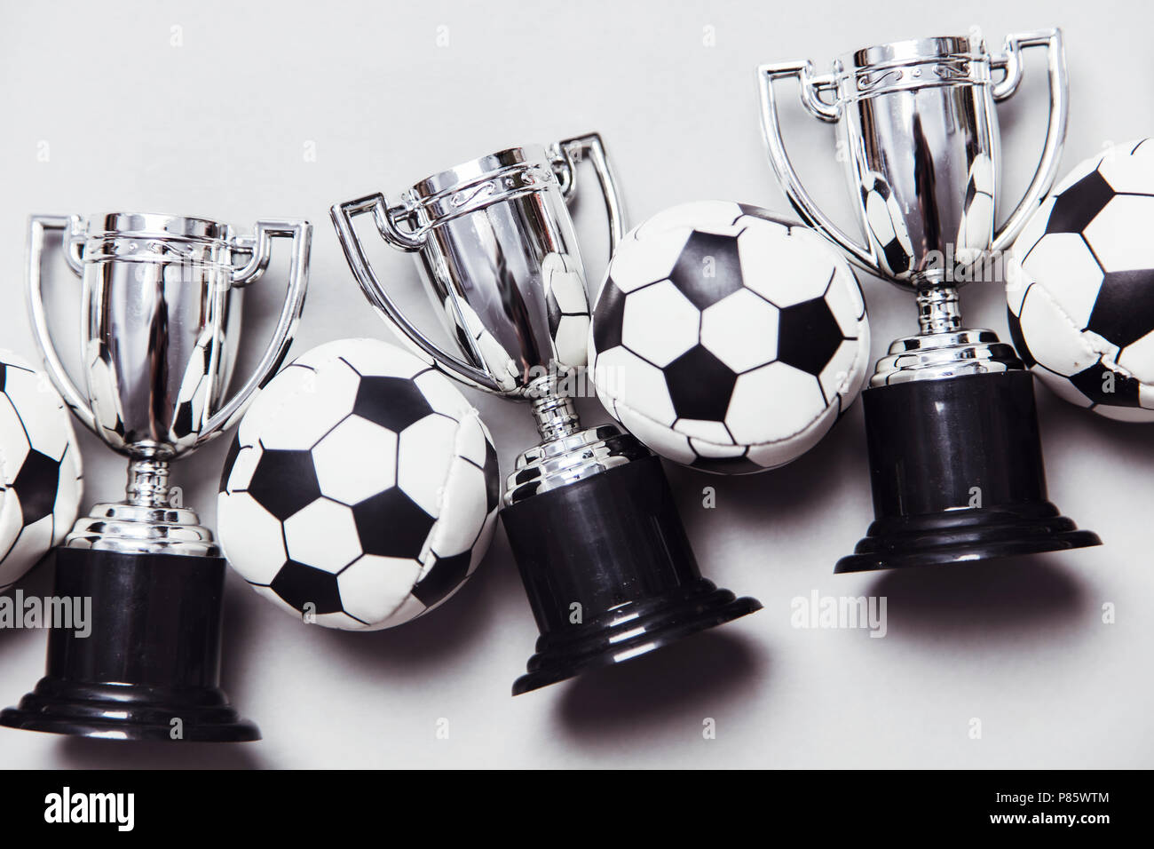Soccer ball with a silver winning trophy Stock Photo - Alamy