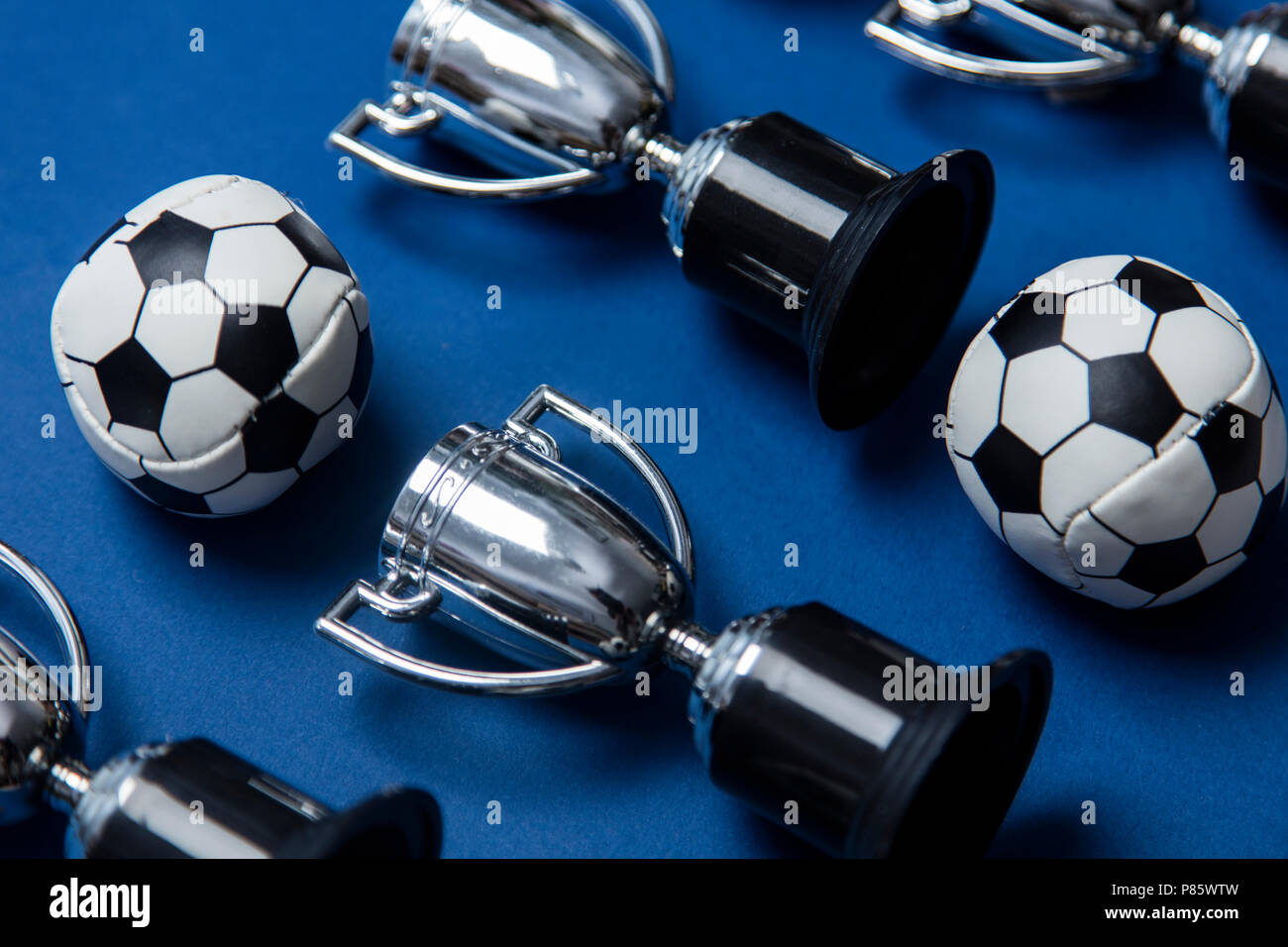 Soccer ball with a silver winning trophy Stock Photo - Alamy