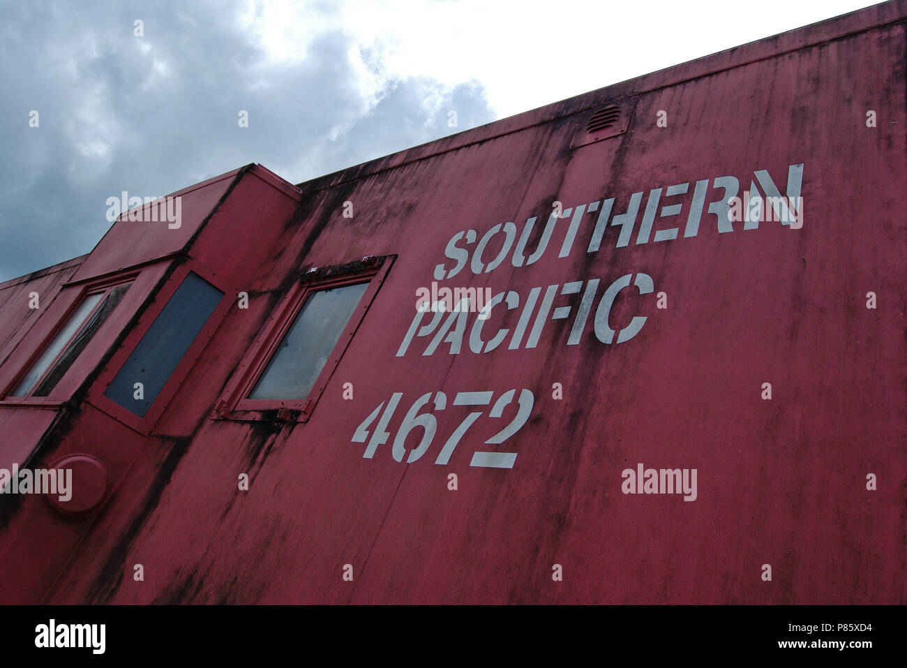 Red caboose train on railroad tracks Stock Photo - Alamy